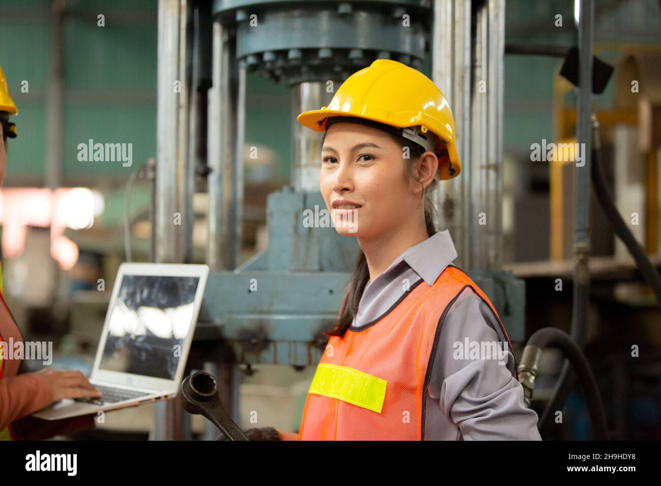 Hard-working engineer holding digital tablet in hands while working in ...