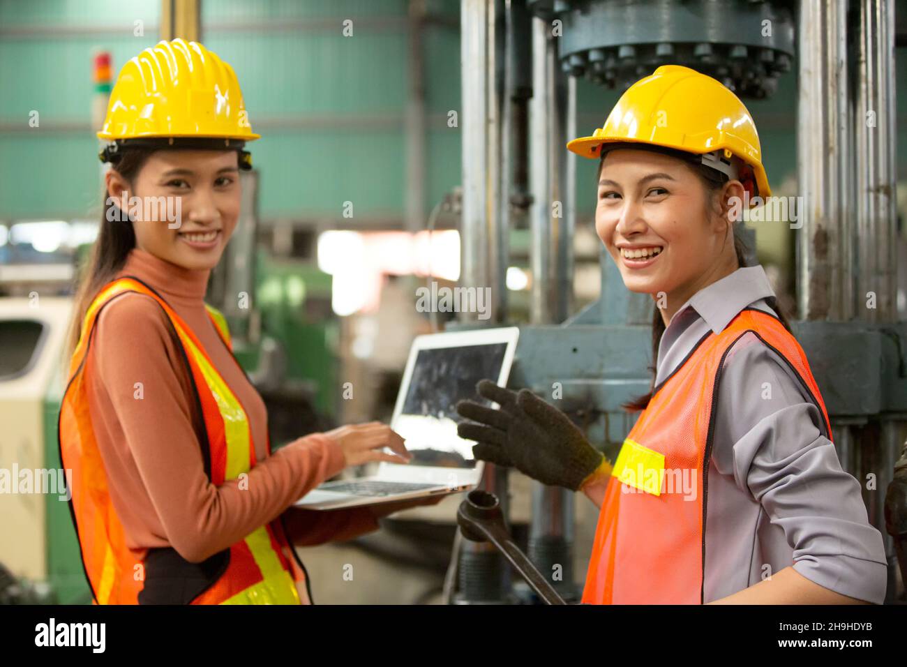 Hard-working engineer holding digital tablet in hands while working in ...