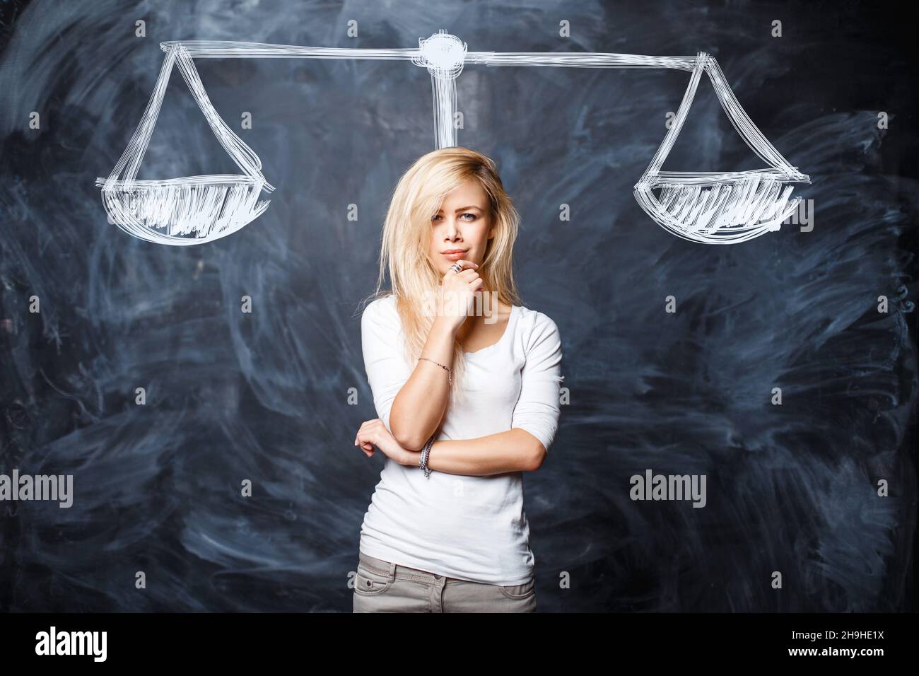 beautiful woman is thinking, weighing the situation, making a choice in ...