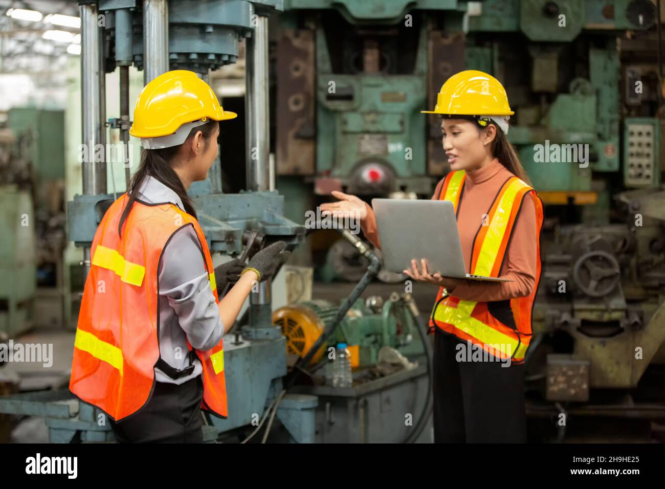 Hard-working engineer holding digital tablet in hands while working in ...