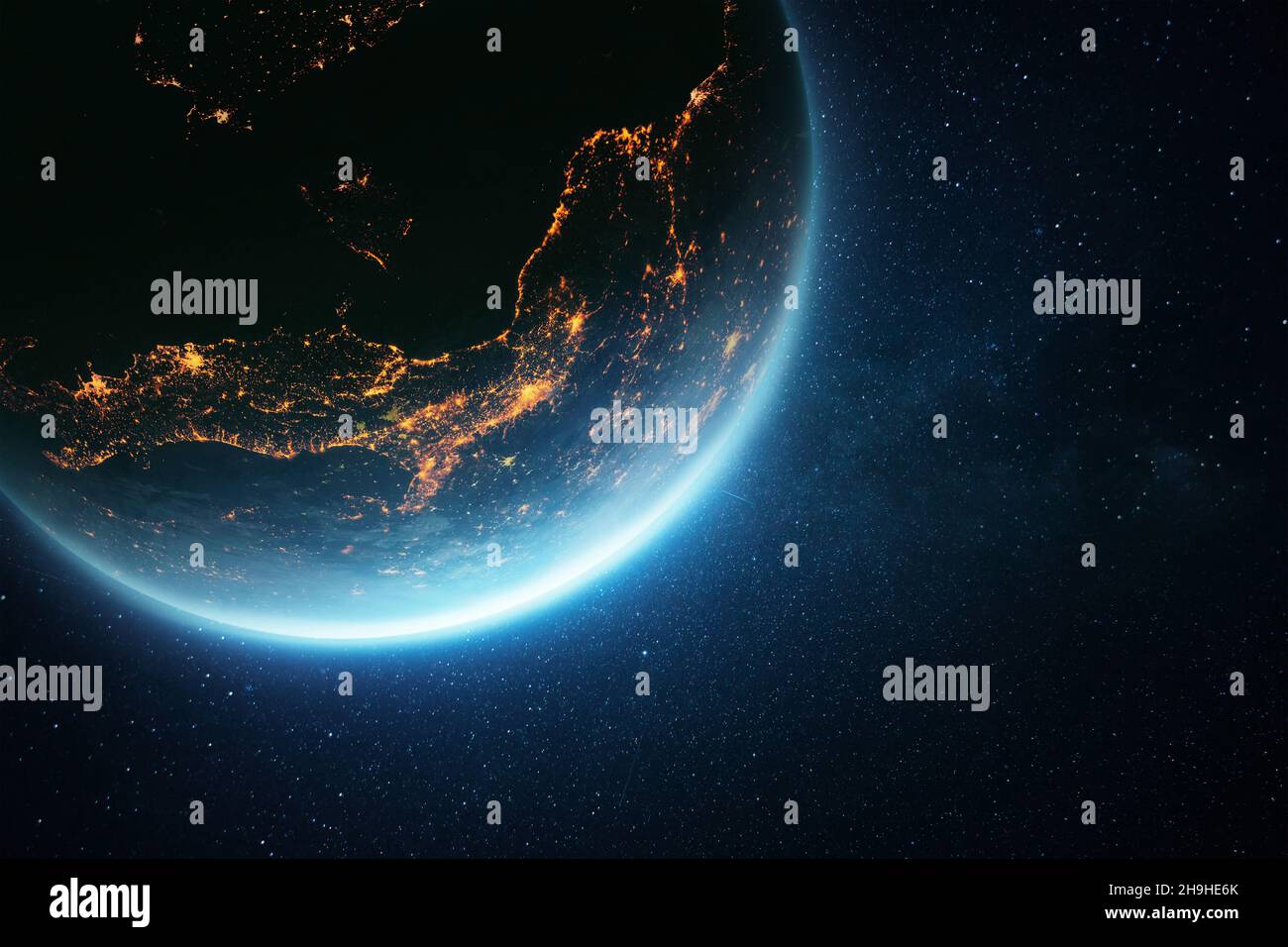 Beautiful amazing planet earth with a blue glow and city lights at ...