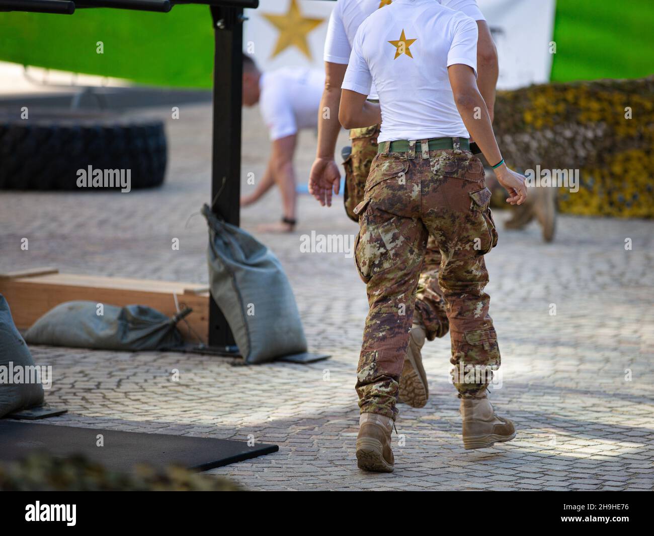 Detail of a Female Soldier's Body: Getting Ready to do Exercises with ...