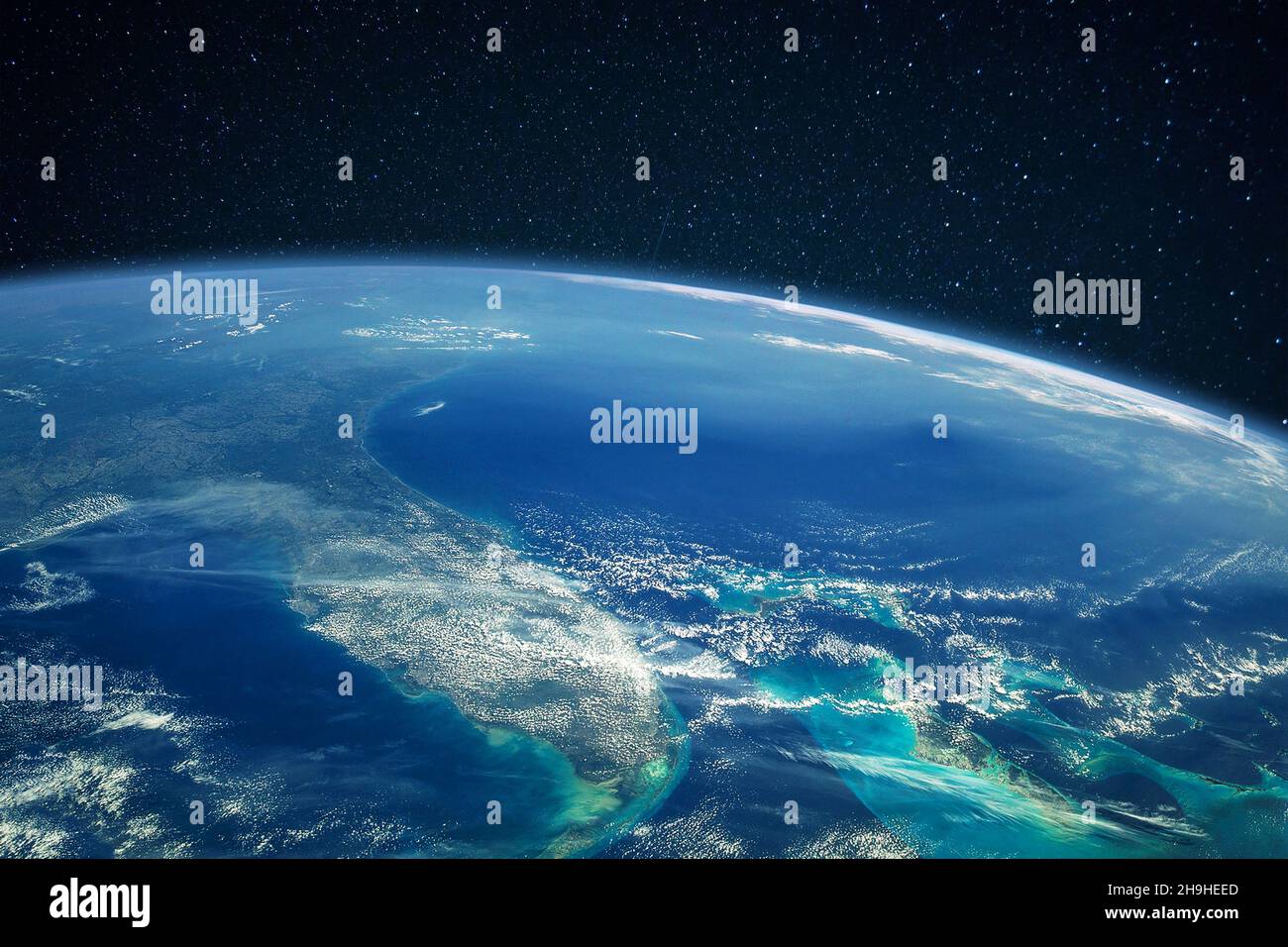 Blue planet earth with ocean and continents in open space on the starry ...