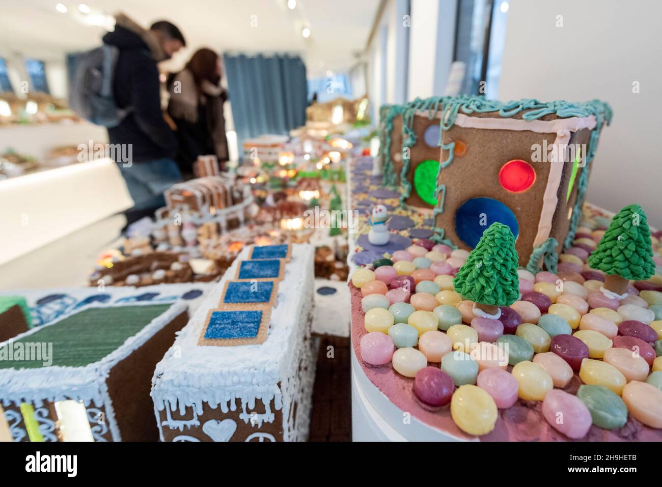 London, UK. 7 December 2021. Visitors view part of The Gingerbread City ...