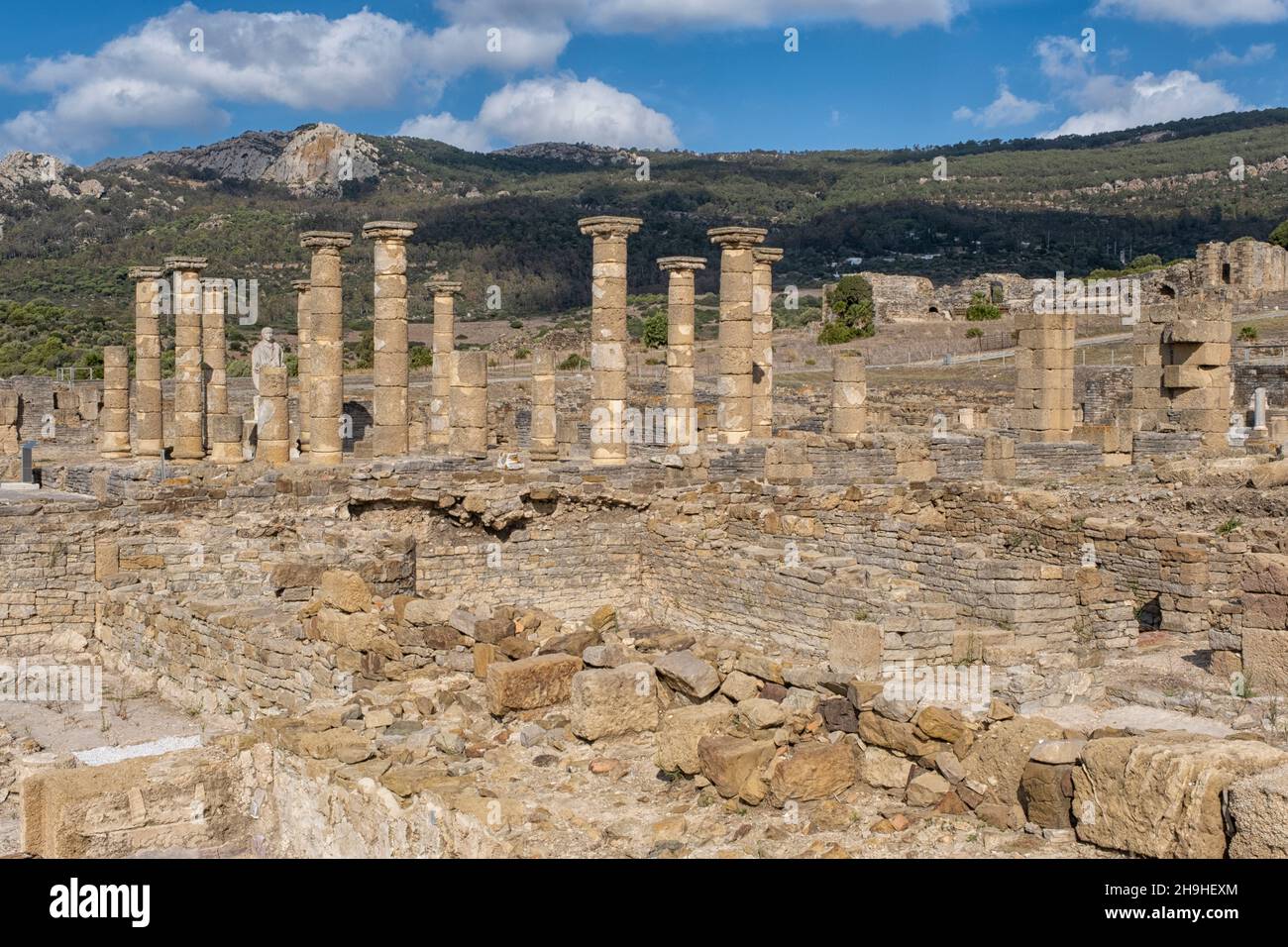 Roman ruins of Baelo Claudia at Bolonia Cadiz Province Spain. Statue of ...