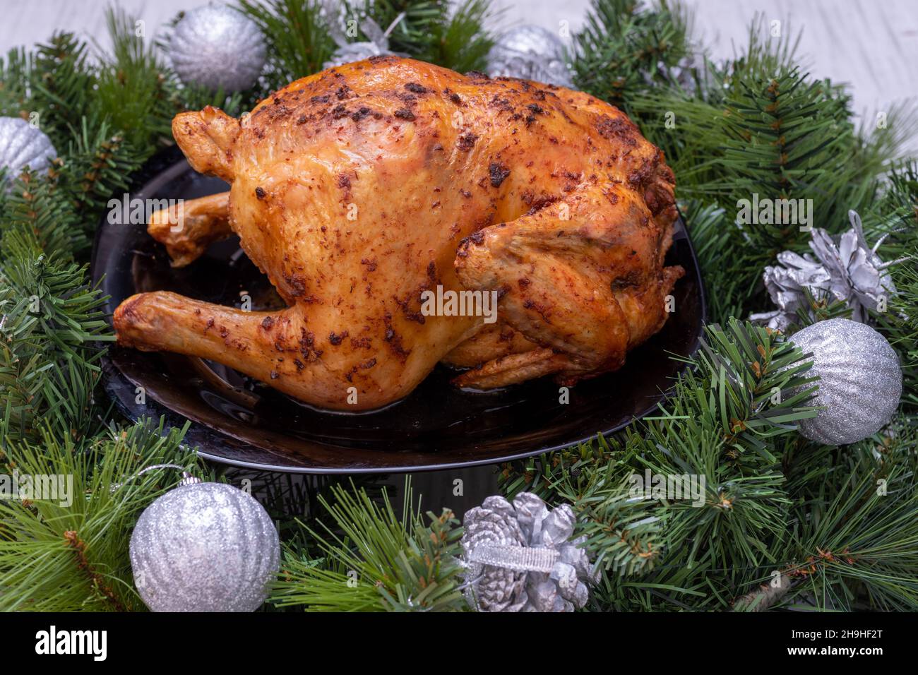 Christmas food. Fried stuffed chicken, turkey on a festive table with ...