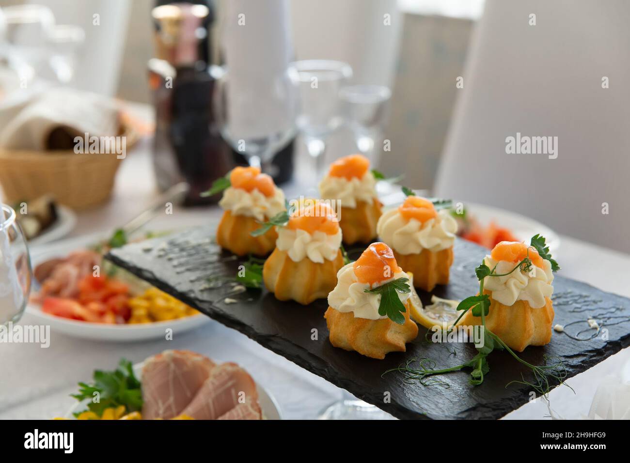 Beautiful table served with glassware and cultery, prepared for festive ...
