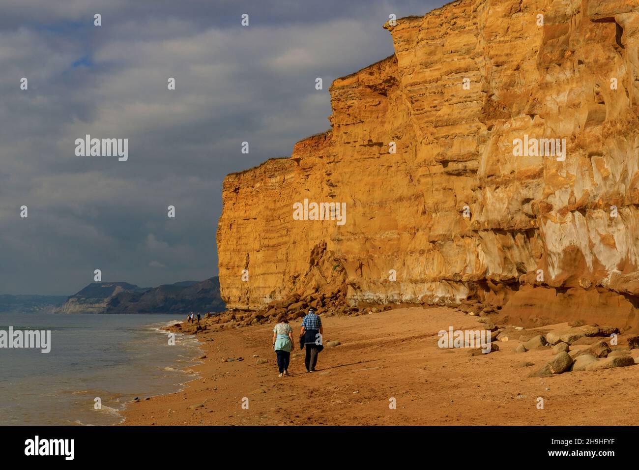 The unstable sandstone cliffs on the Jurassic Coast at Burton Bradstock ...