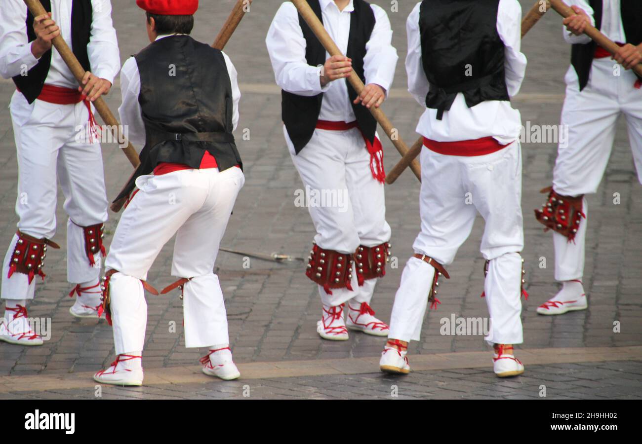 View of people with traditional clothes dancing a folk dance in Basque ...