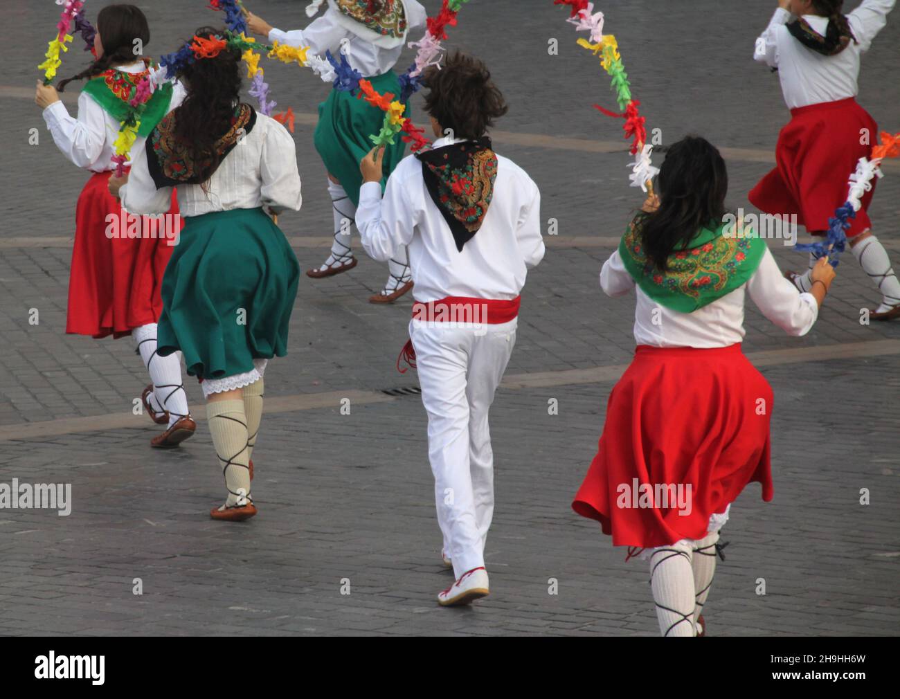 Beautiful shot of a group of people dancing a folk on festival in ...