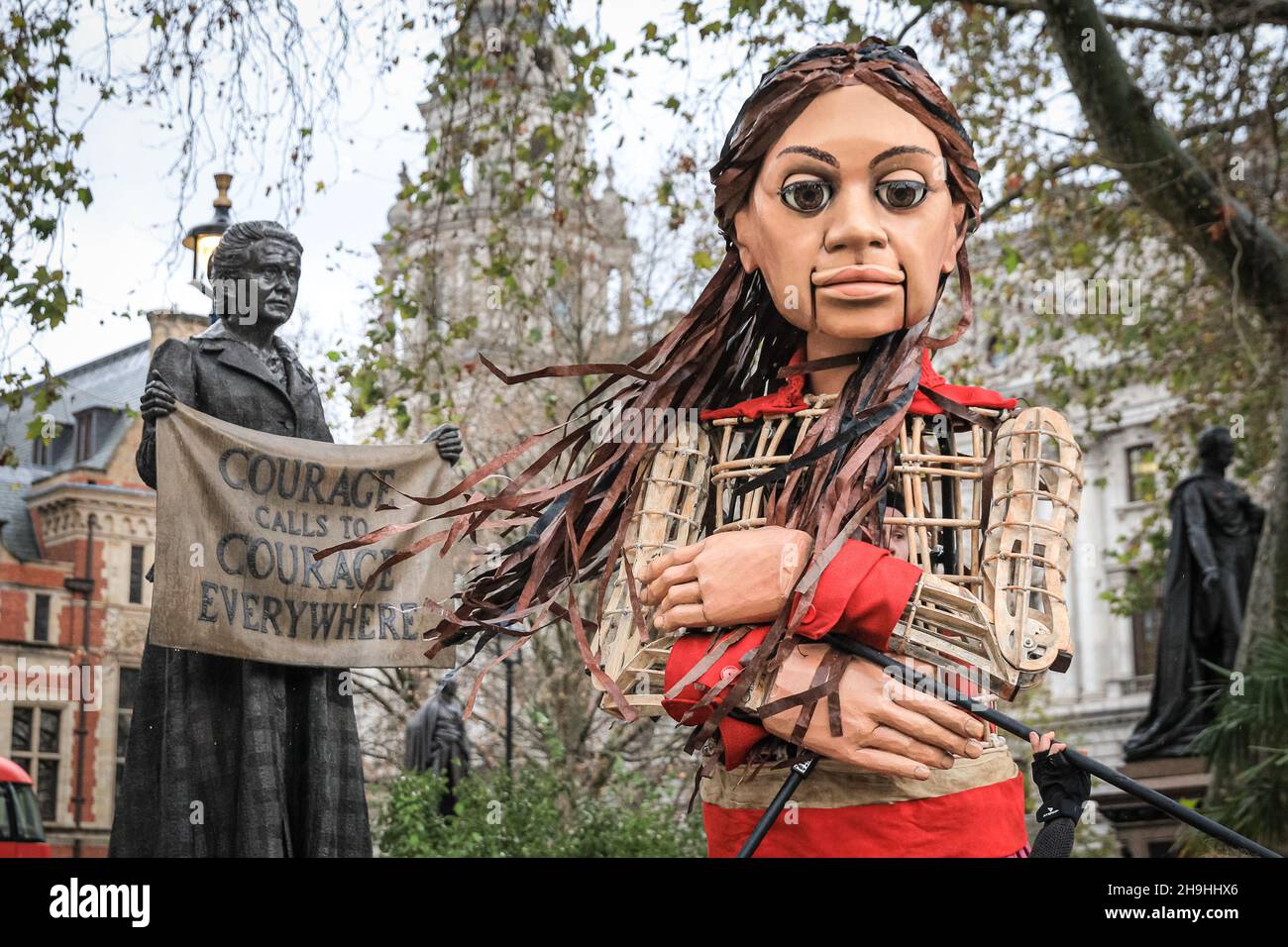 Westminster, London, UK. 7th Dec, 2021. Little Amal with the statue of ...
