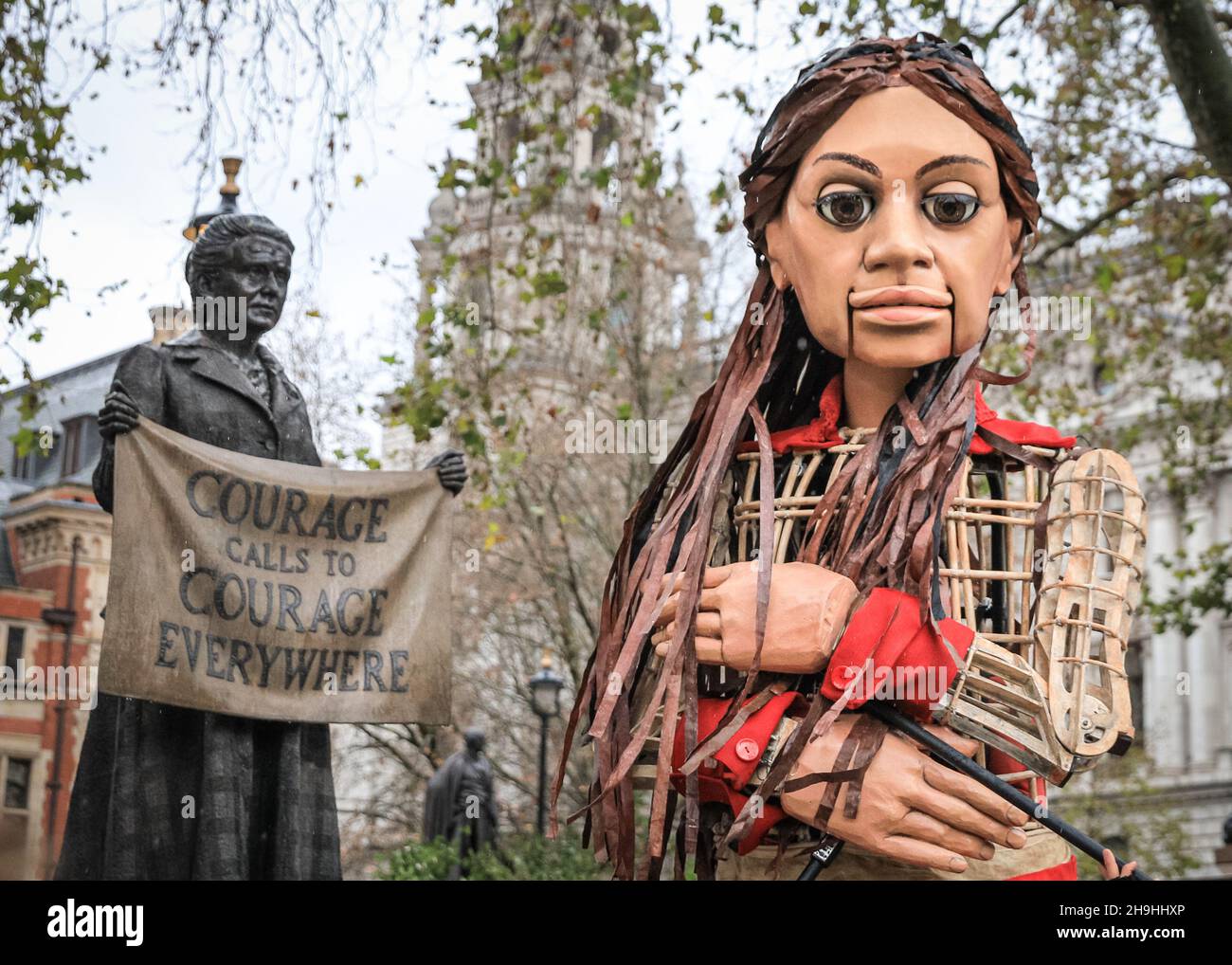 Westminster, London, UK. 7th Dec, 2021. Little Amal with the statue of ...
