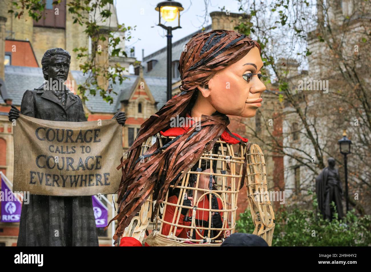 Westminster, London, UK. 7th Dec, 2021. Little Amal with the statue of ...