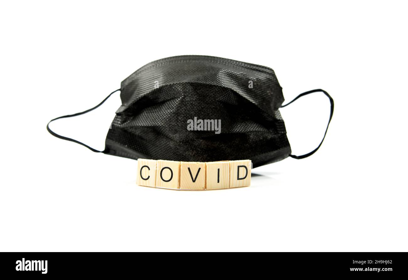 a black face mask on white background Stock Photo - Alamy