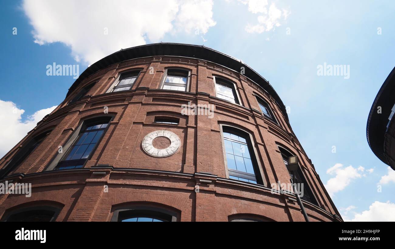 Bottom view of beautiful building with round architecture on background ...