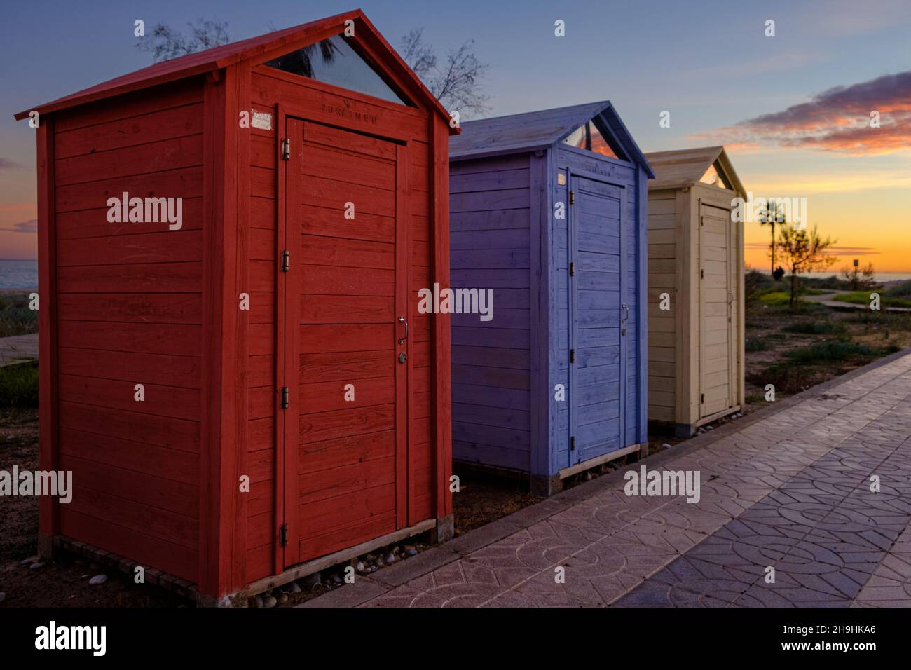 Colorful wooden huts on the beach Stock Photo - Alamy
