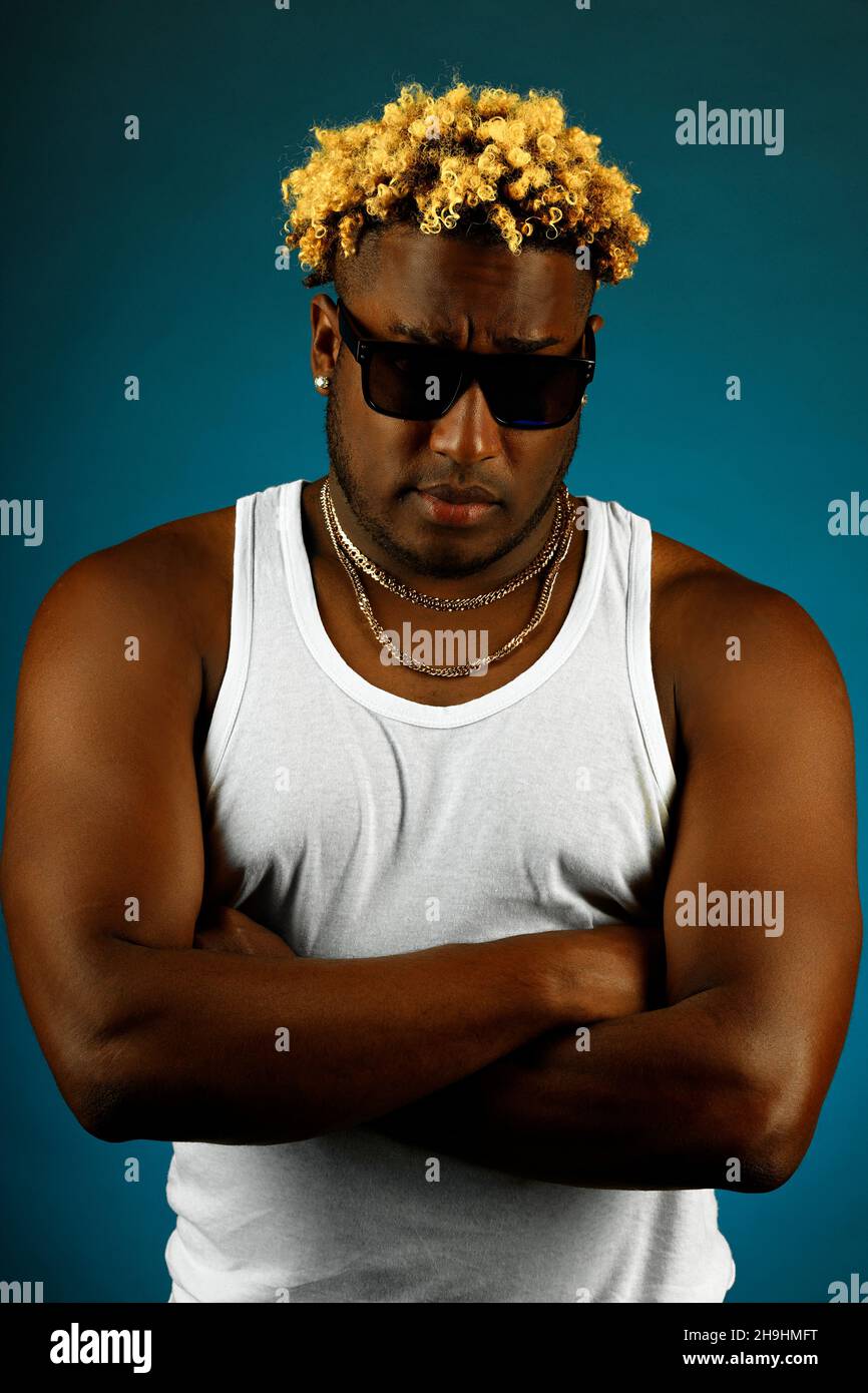 This is a studio portrait of an African American in sunglasses and a ...