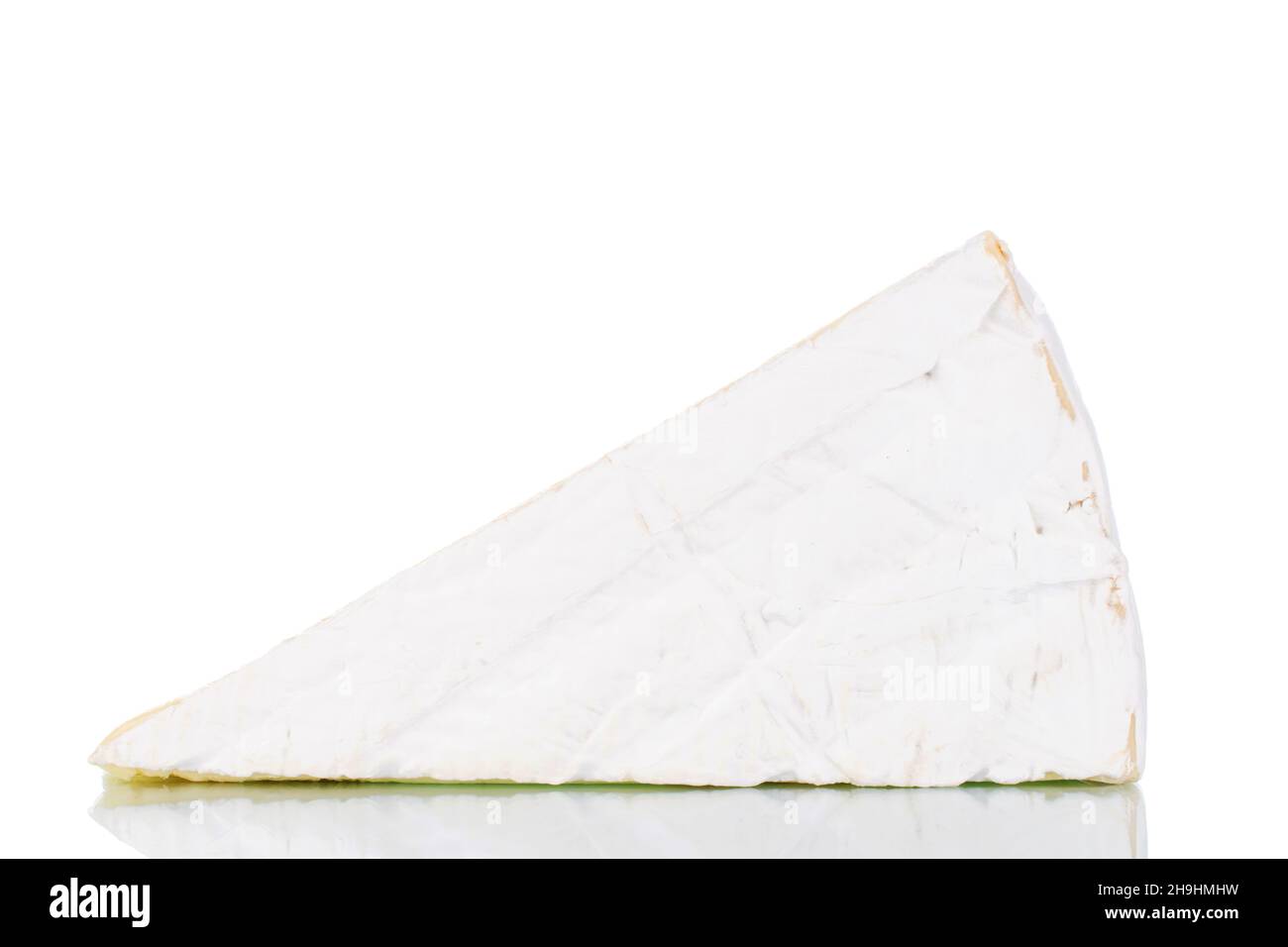 One fresh slice of brie cheese, close up, isolated on white Stock Photo ...