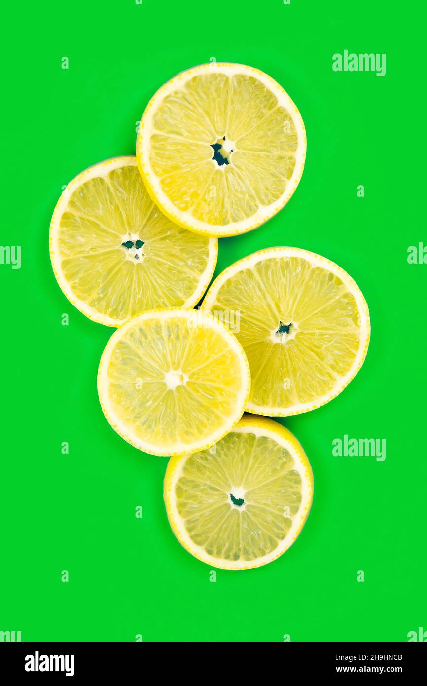 Pile of fresh lemon slices. Flat lay, top view, copy space Stock Photo ...