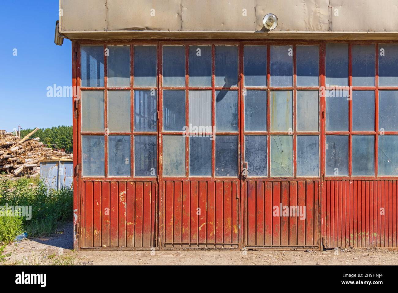 Closed Doors at Old Workshop With Dirty Windows Stock Photo - Alamy
