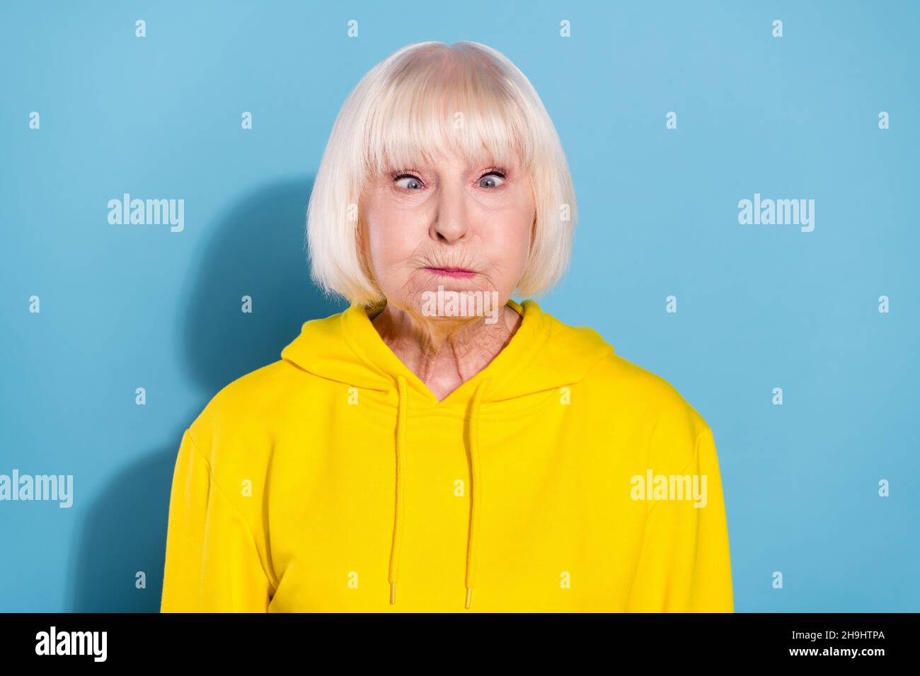 Photo of happy funky old woman hold breath cheeks make funny face ...