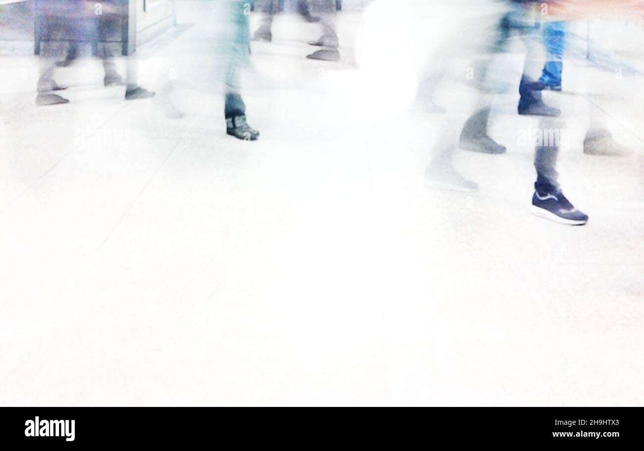 Commuters feet during rush hour at London Bridge station, taken using ...