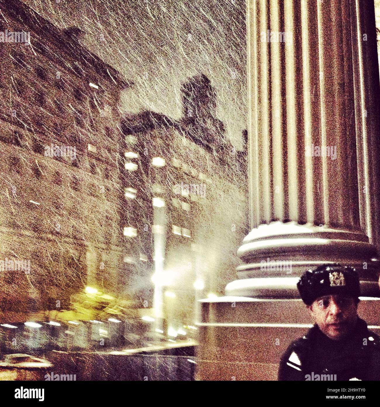 The New York blizzard arrives. A NYPD policeman at the Museum of ...