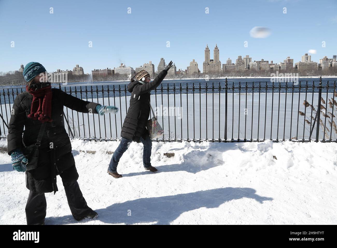 New Yorker Gillian Wolfe and visitor Julie Carney throwing snow balls ...
