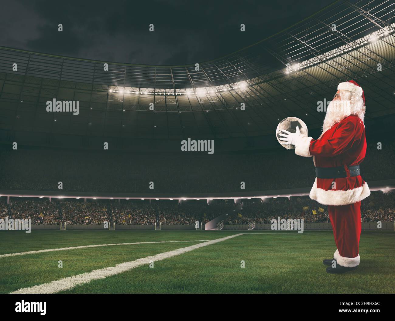 Santa Claus with a soccer ball in his hands inside a soccer stadium ...