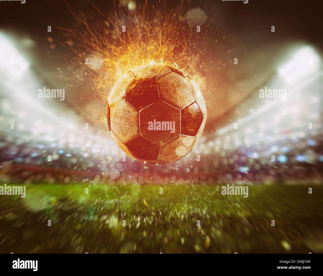 Close up of a fiery soccer ball kicked with power at the stadium ...