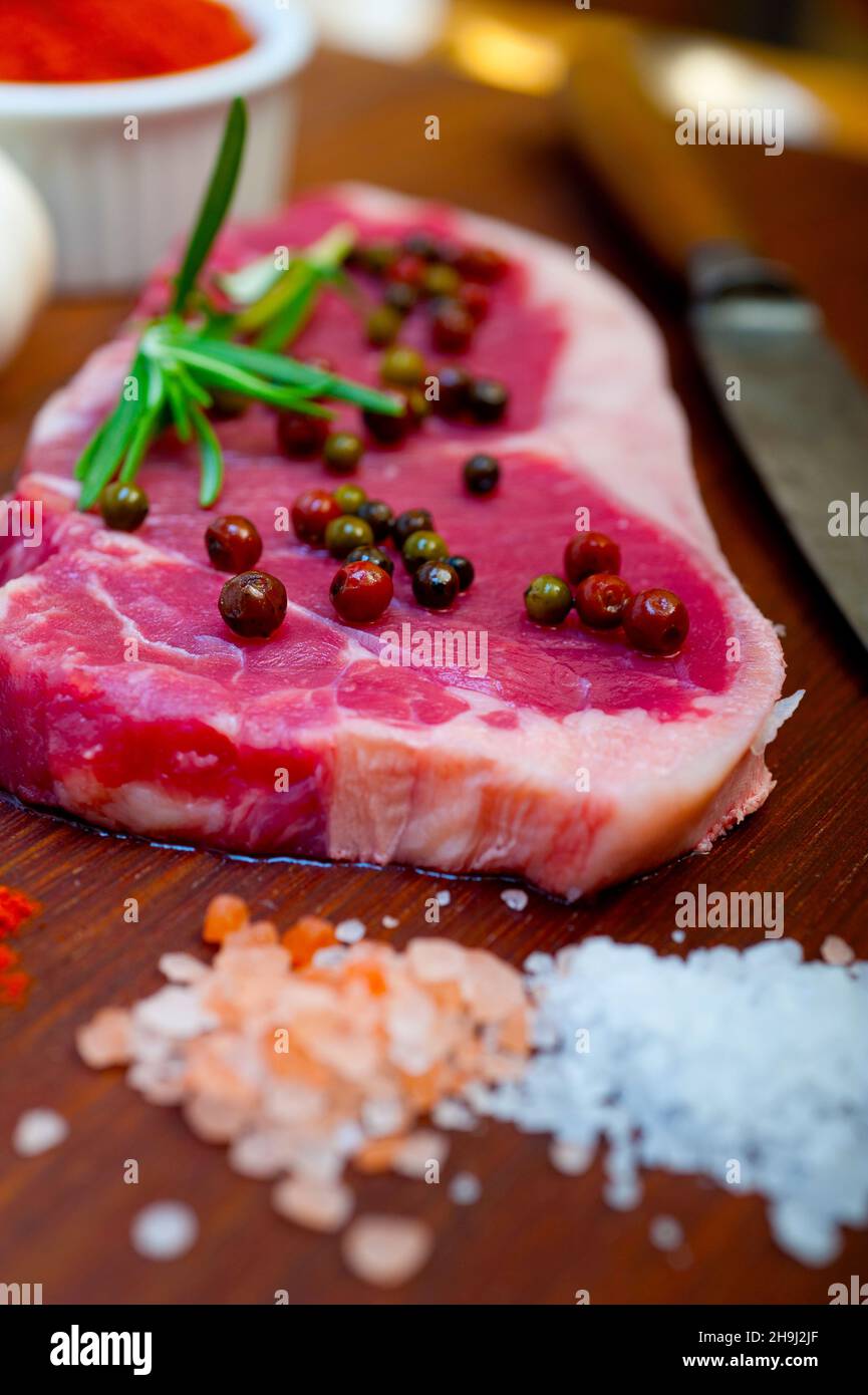 raw uncooked ribeye beef steak butcher selection Stock Photo - Alamy