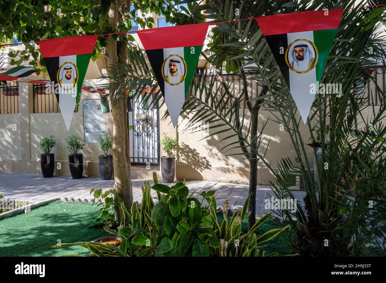 Flags depicting the UAE leaders and national colours hung outside a ...