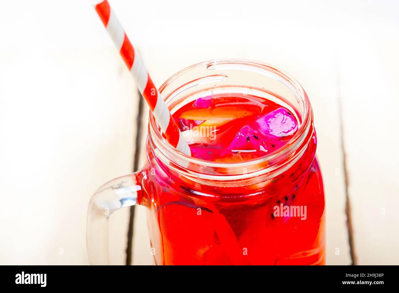fresh fruit punch refreshing summer drink over white rustic wood table ...