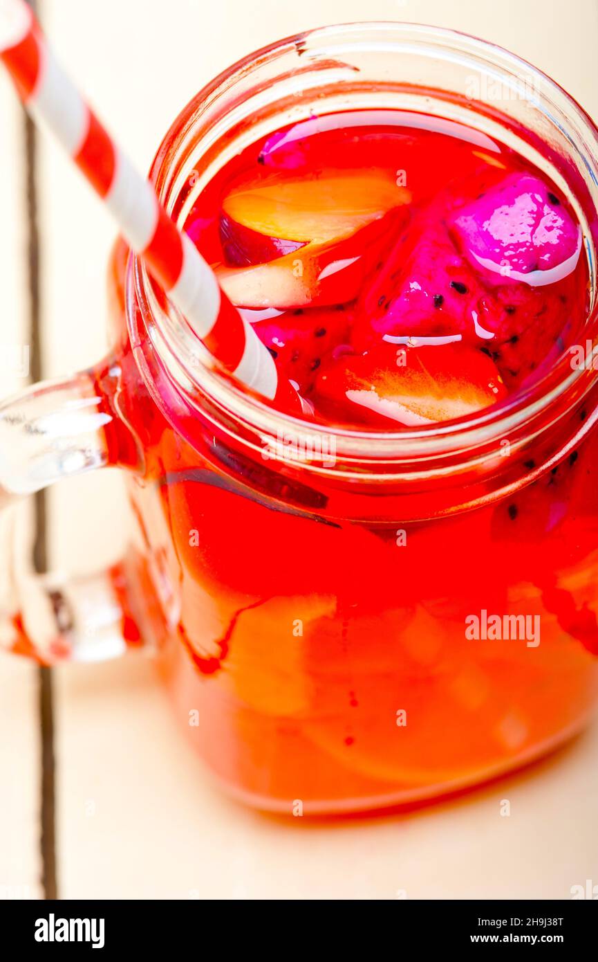 fresh fruit punch refreshing summer drink over white rustic wood table ...