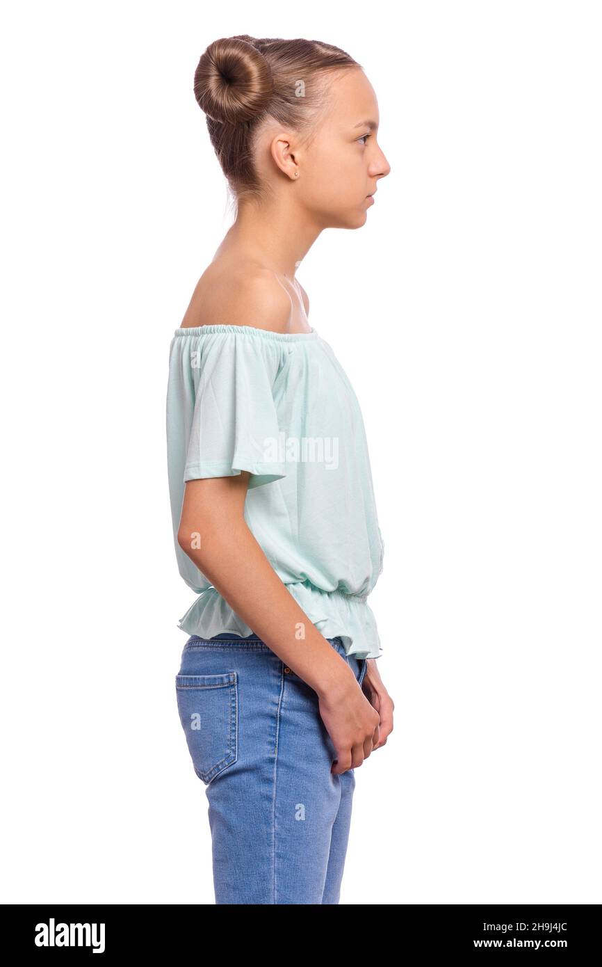 Profile portrait of serious young girl, isolated over white background ...