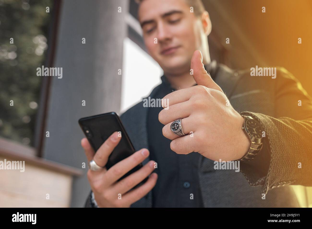 Business man holding one finger hi-res stock photography and images - Alamy