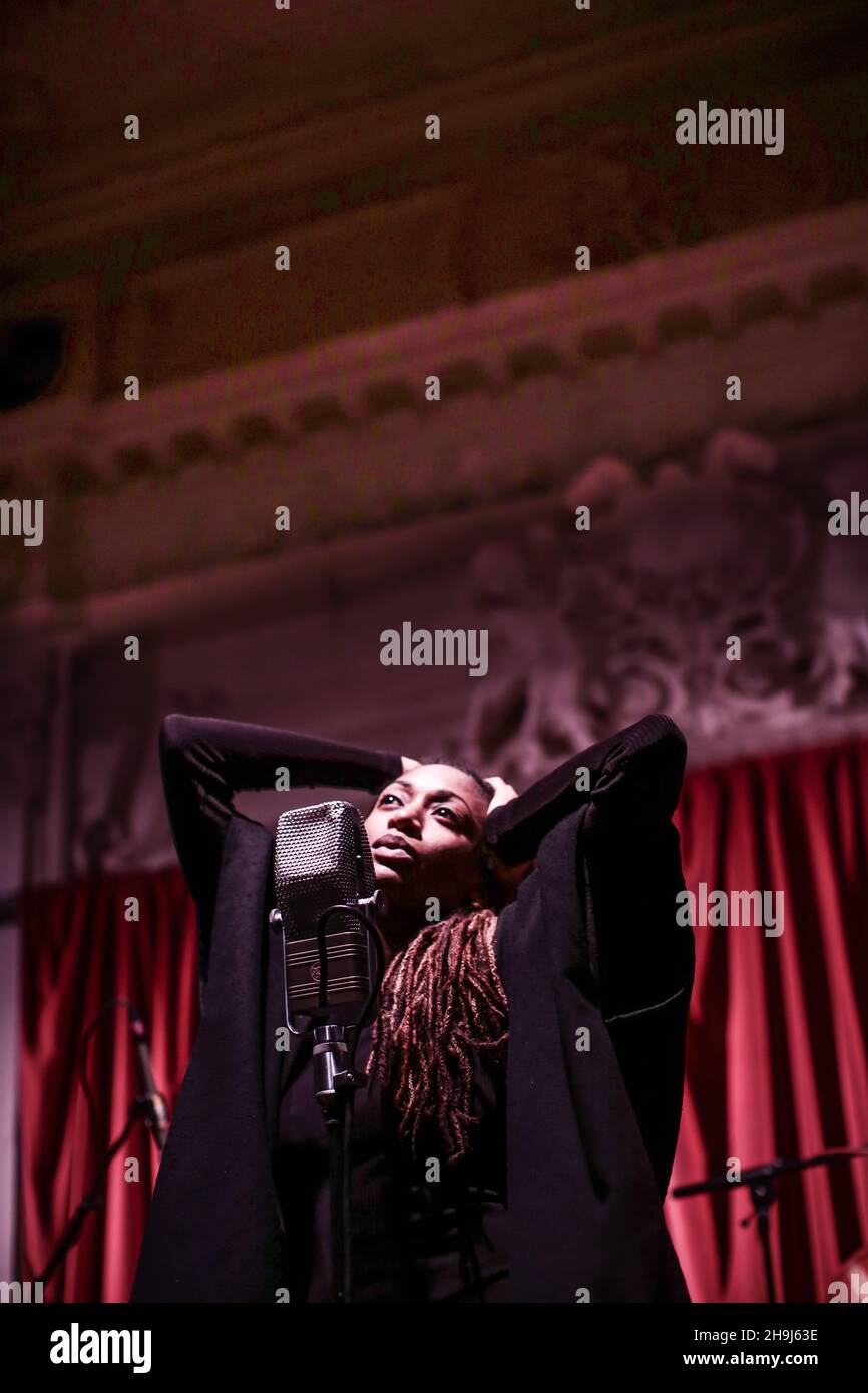 ALA.NI performing with her band on stage at Bush Hall supporting Ibeyi ...