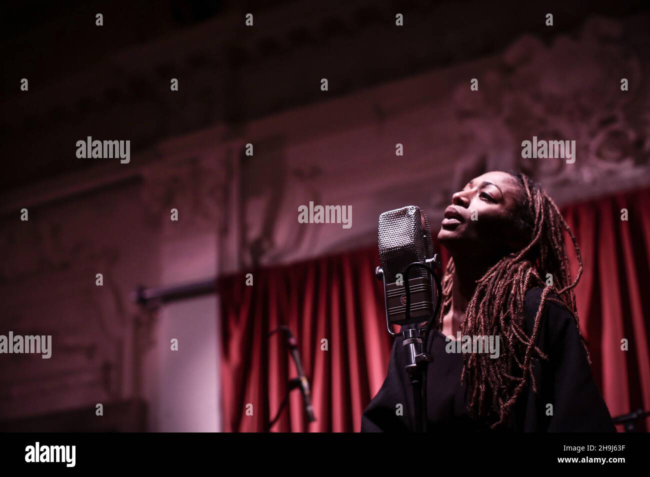 ALA.NI performing with her band on stage at Bush Hall supporting Ibeyi ...