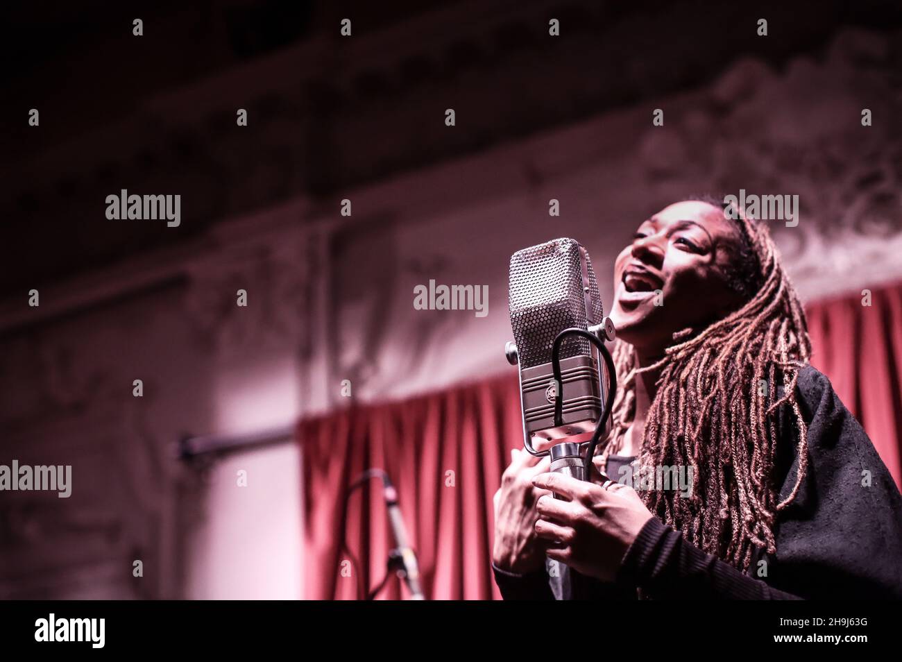 ALA.NI performing with her band on stage at Bush Hall supporting Ibeyi ...