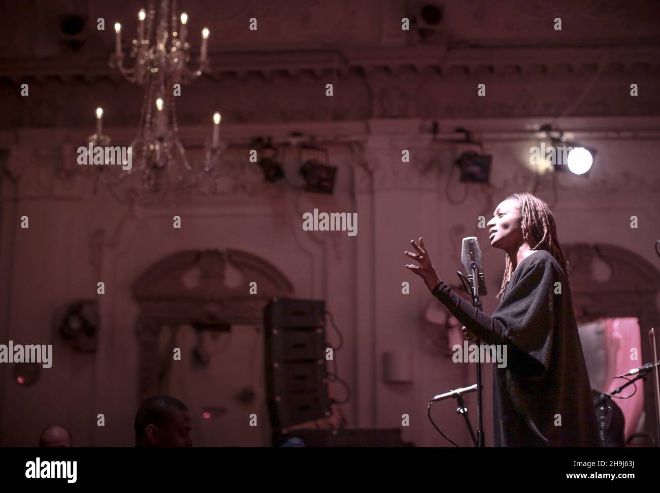 ALA.NI performing with her band on stage at Bush Hall supporting Ibeyi ...