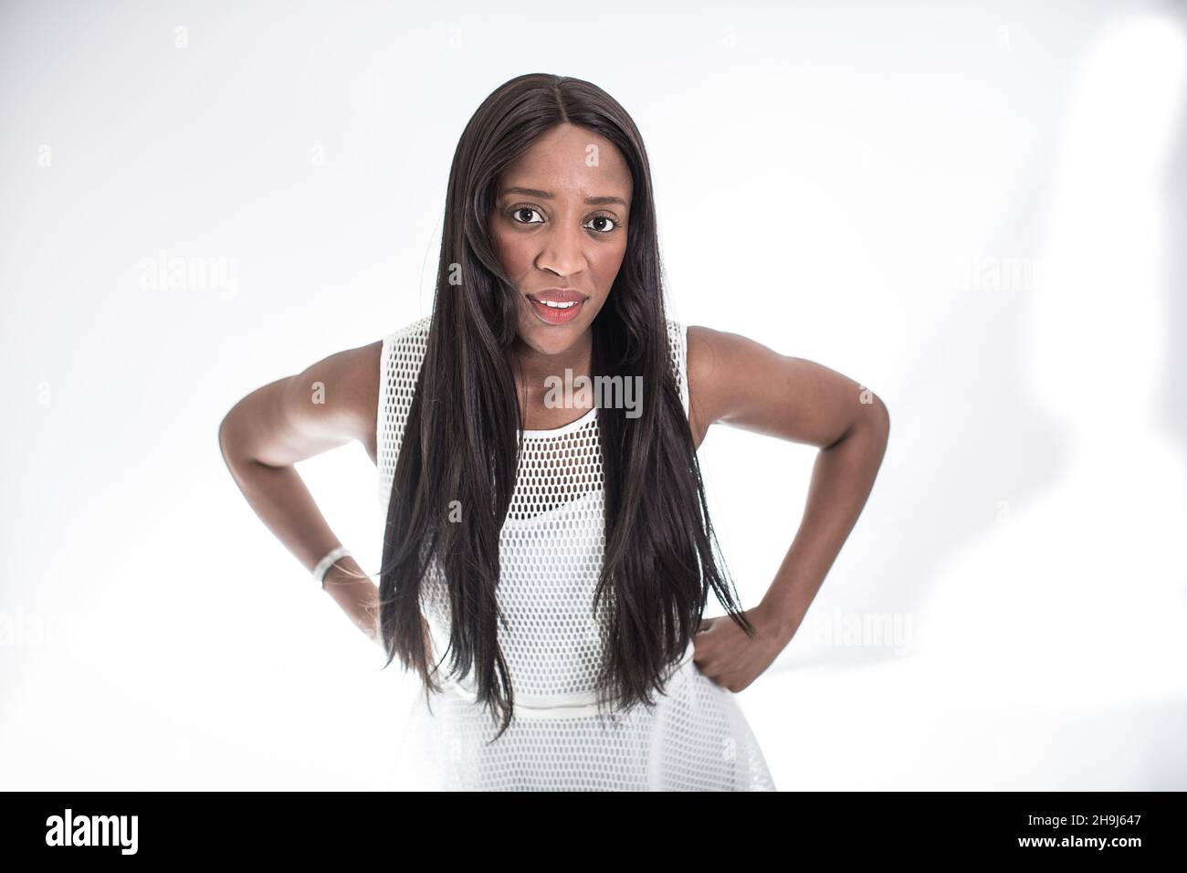 Eki Maria posing for portraits at rugfoot studios. Maria is a stand-up ...