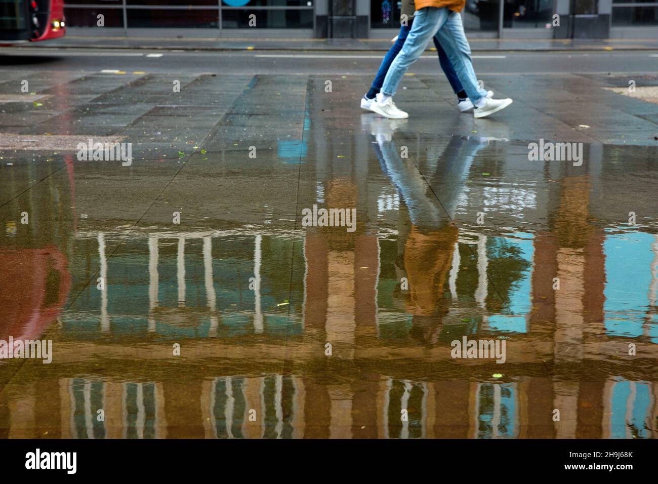 A puddle is seen on a high street in central London Stock Photo - Alamy