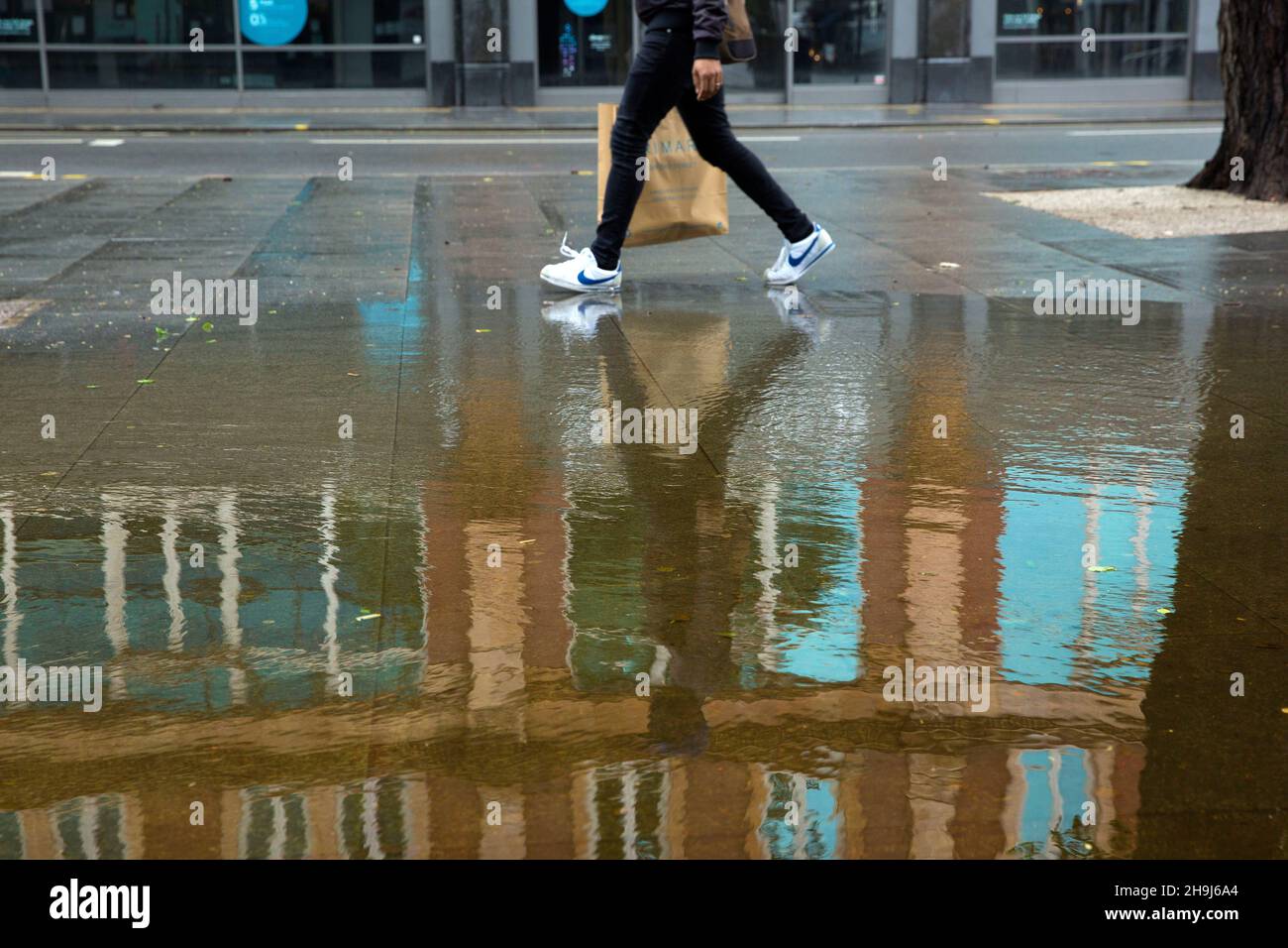 A puddle is seen on a high street in central London Stock Photo - Alamy
