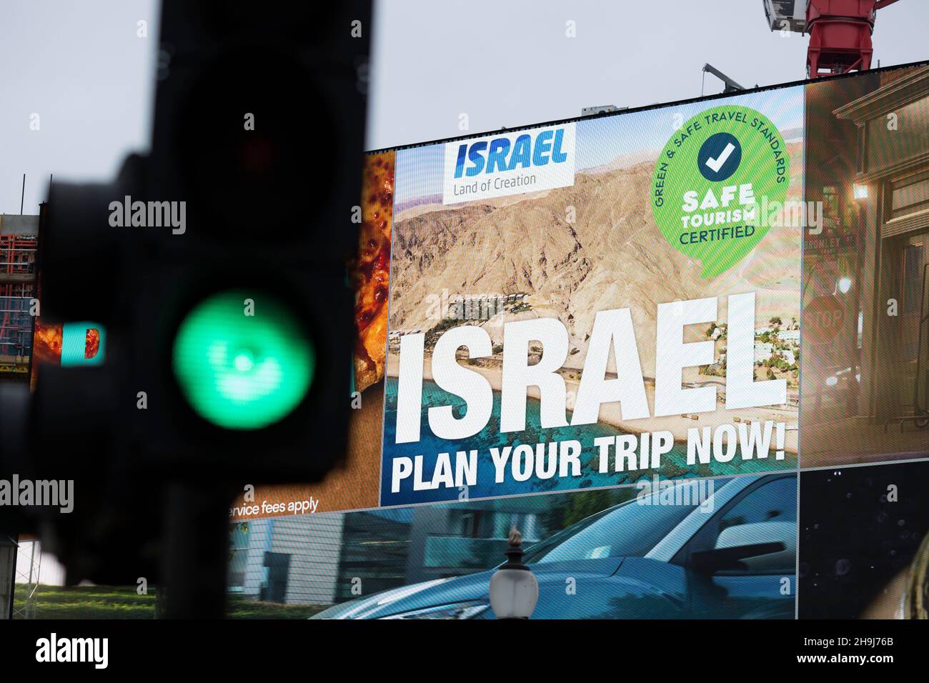 An advertisement for Israeli tourism is displayed on a large electric ...