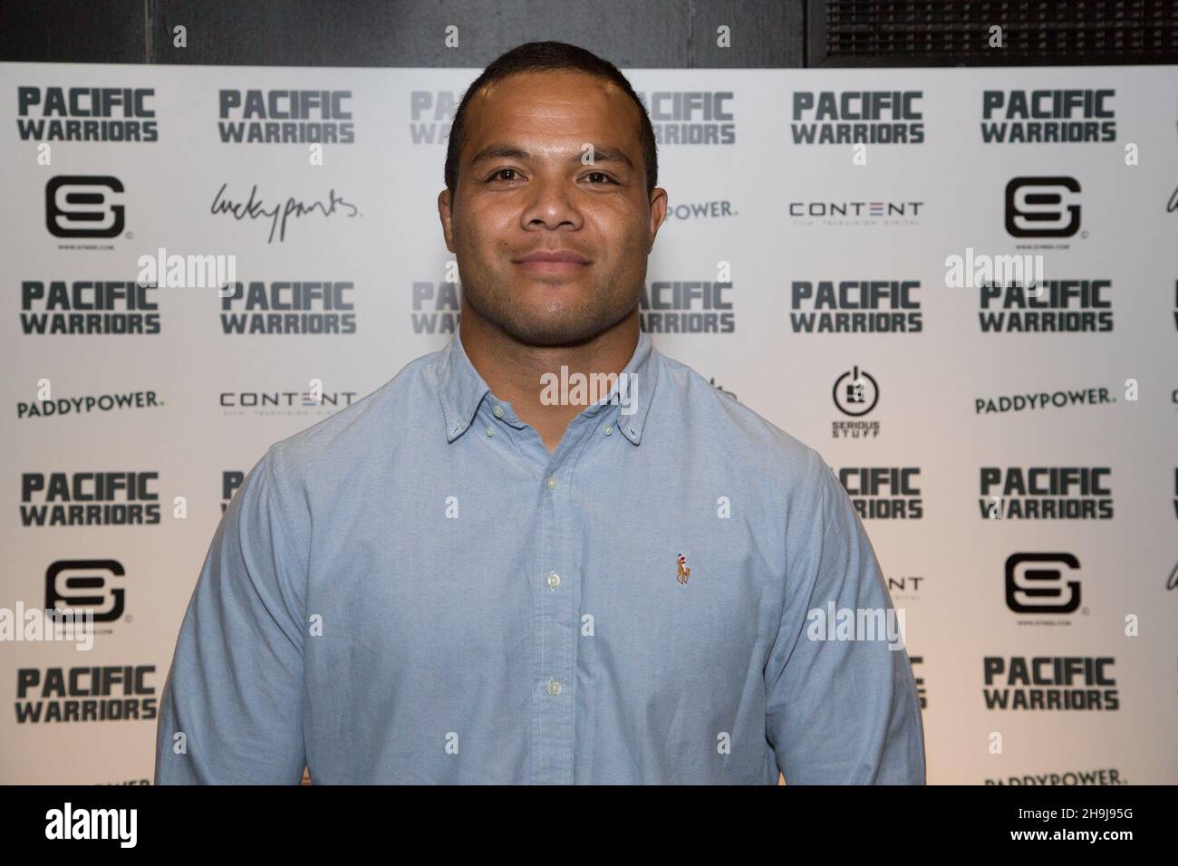 Eddie Aholelei poses for photos as former and current players from the ...