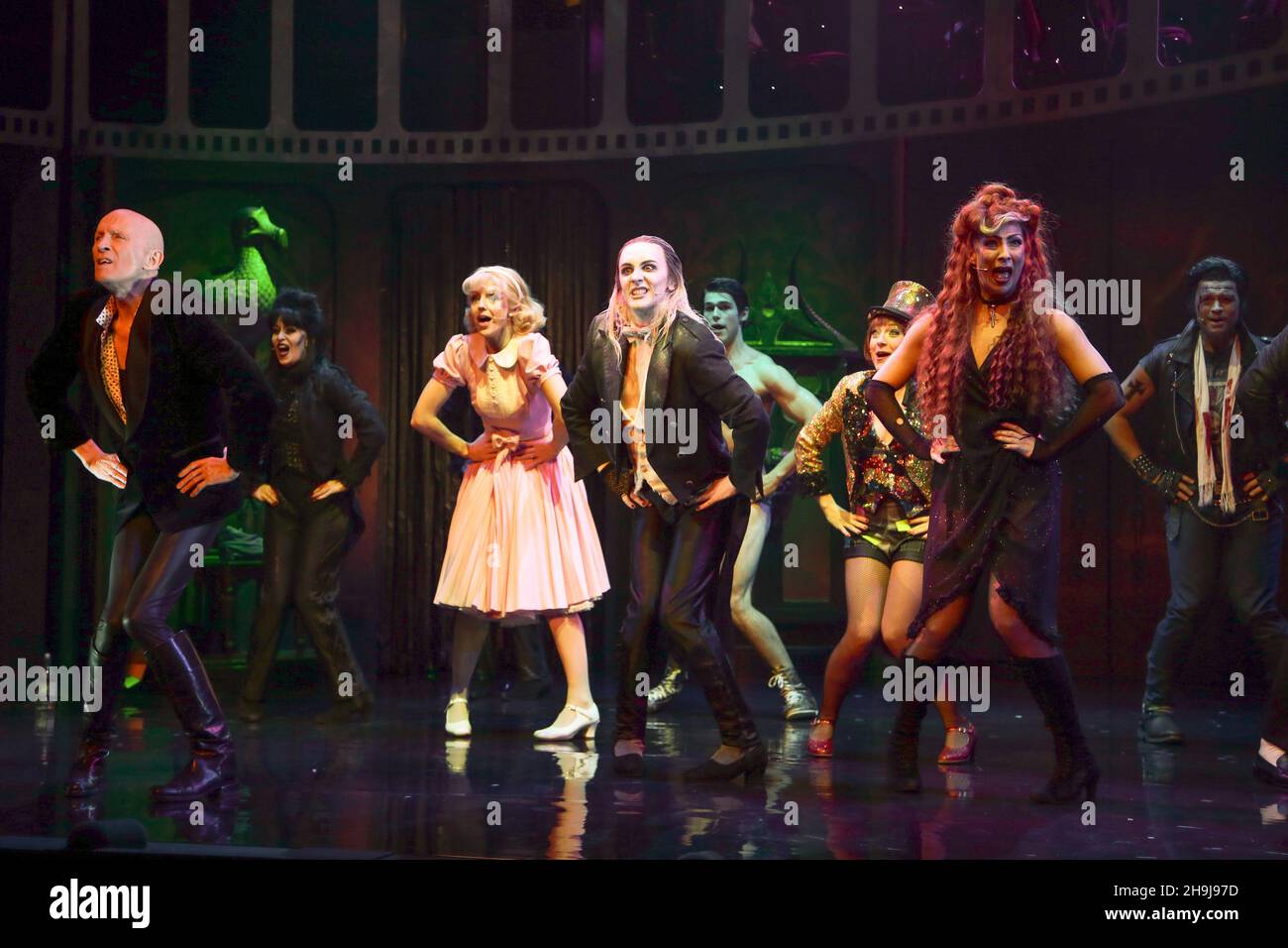 The cast of the Rocky Horror Show performing on stage at a press call ...