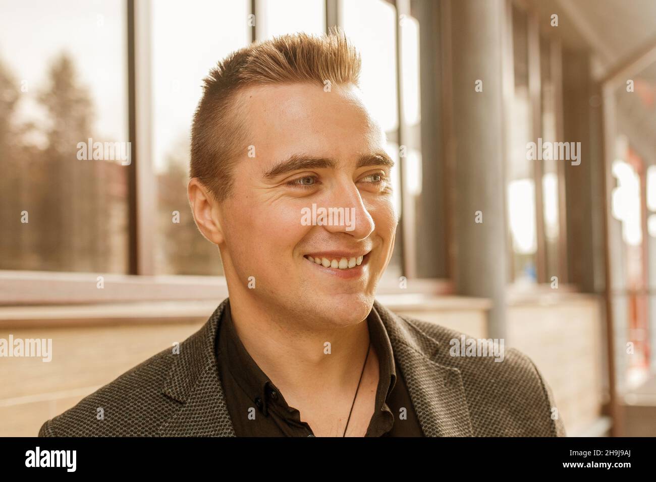 Close-up portrait of a positive smiling handsome guy of Caucasian ...