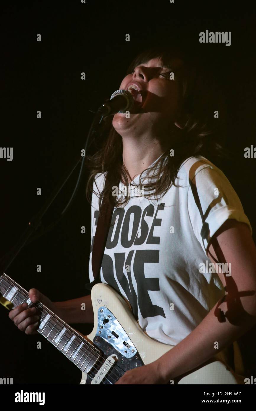 Courtney Barnett and her band performing live on stage at The O2 Forum ...