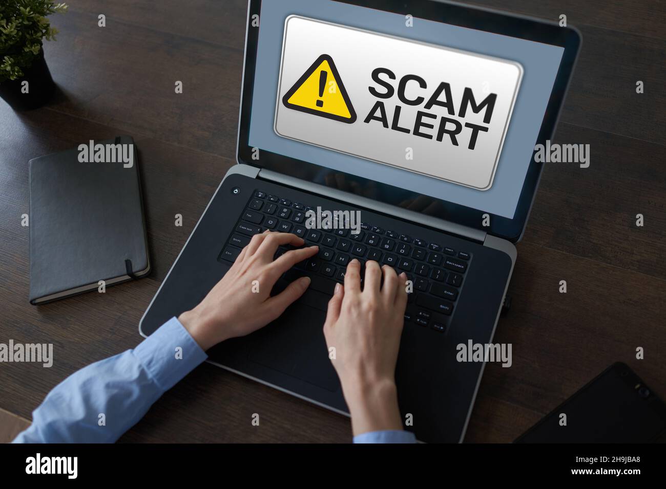 Scam alert detecting warning. Notification on device screen Stock Photo ...
