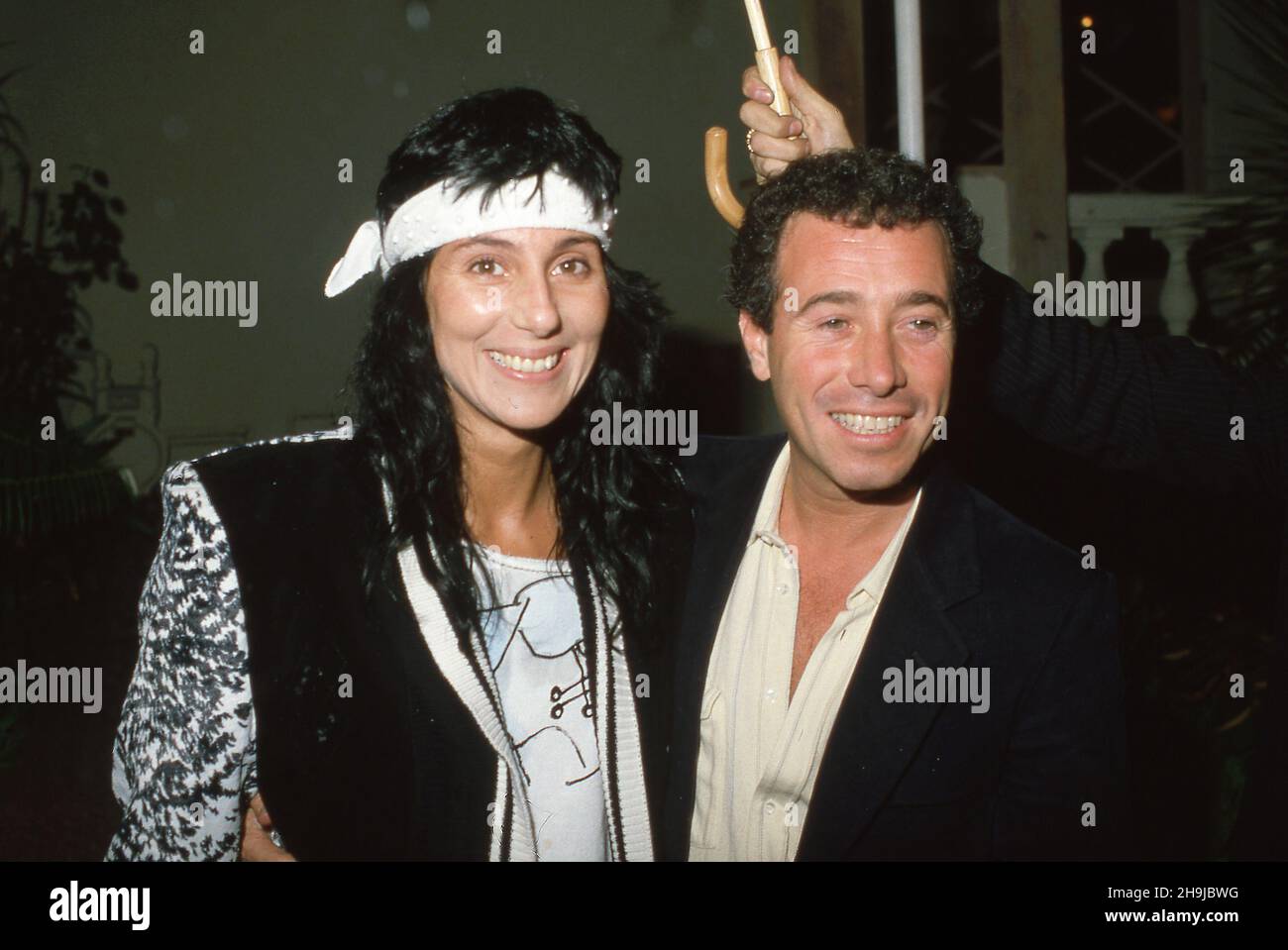 Cher and producer David Geffen attend "The Year of Living Dangerously ...